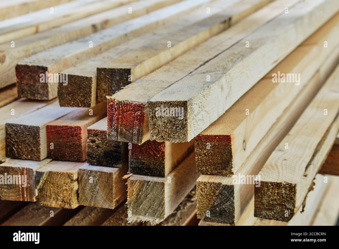 Construction material made of machined wood sticks Stock Photo - Alamy