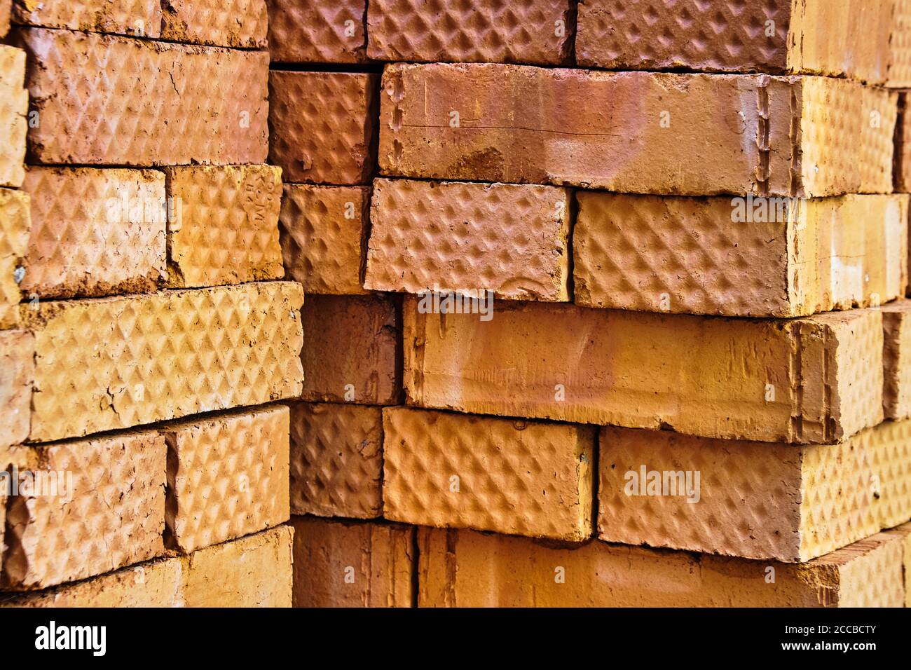 Building materials warehouse of folded big bricks Stock Photo - Alamy