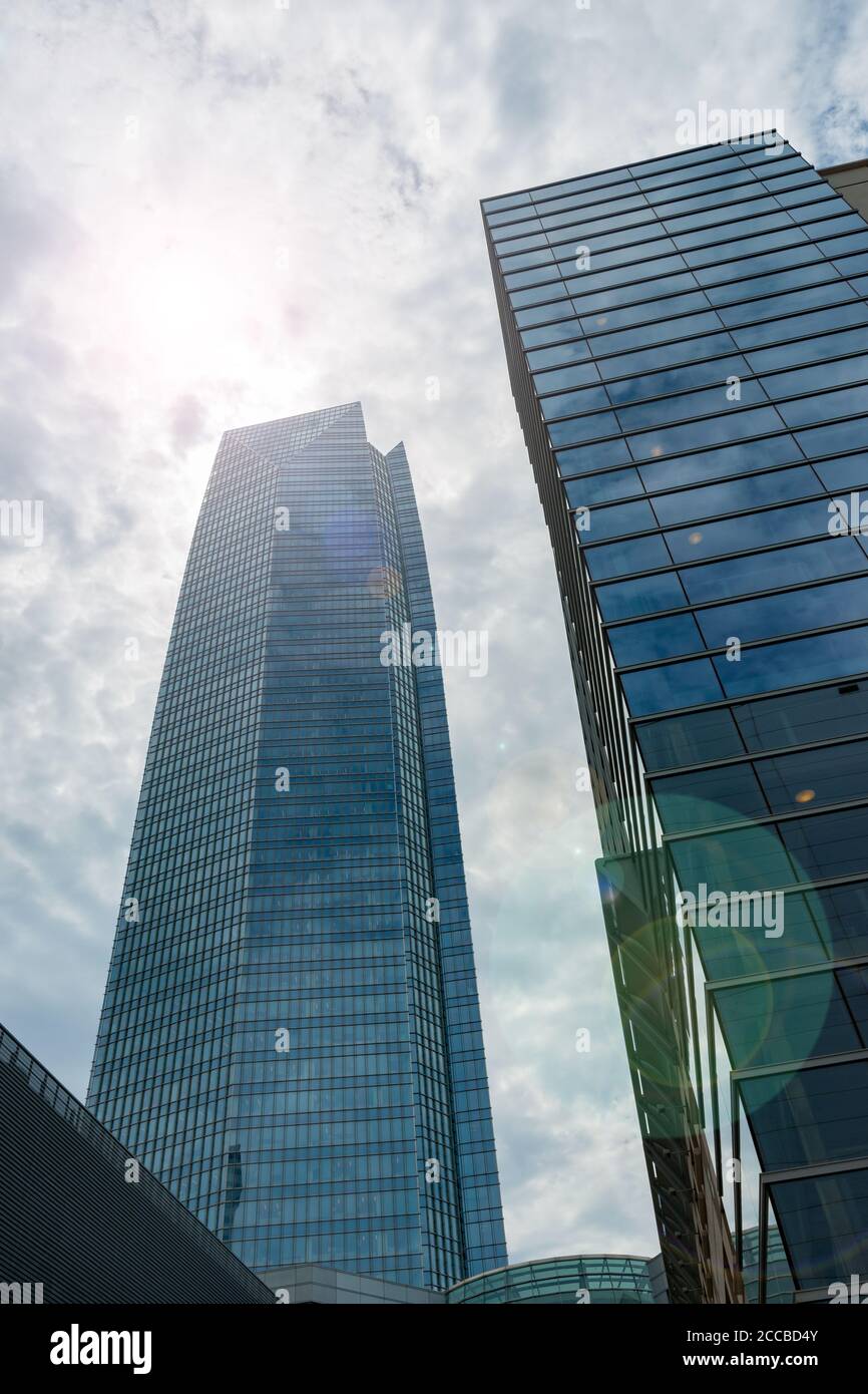 Tall modern high-rise commercial buildings rising skyward converging ...