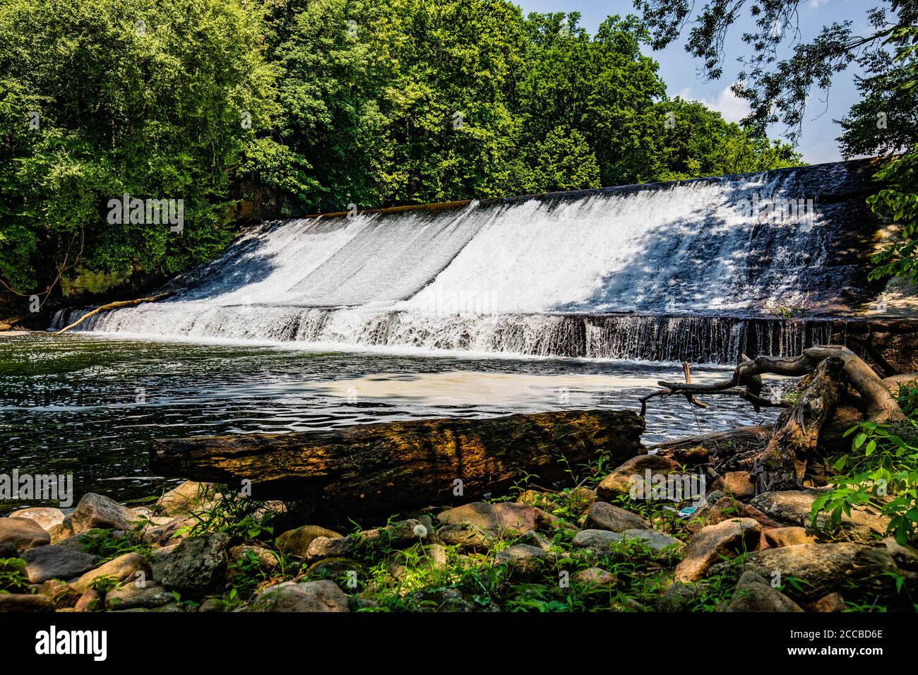 Small scenic river dam in the forest at summer day hiking destination ...