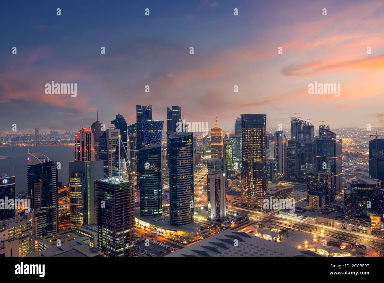 The skyline of Doha during sunset. Aerial View of Doha City Stock Photo ...