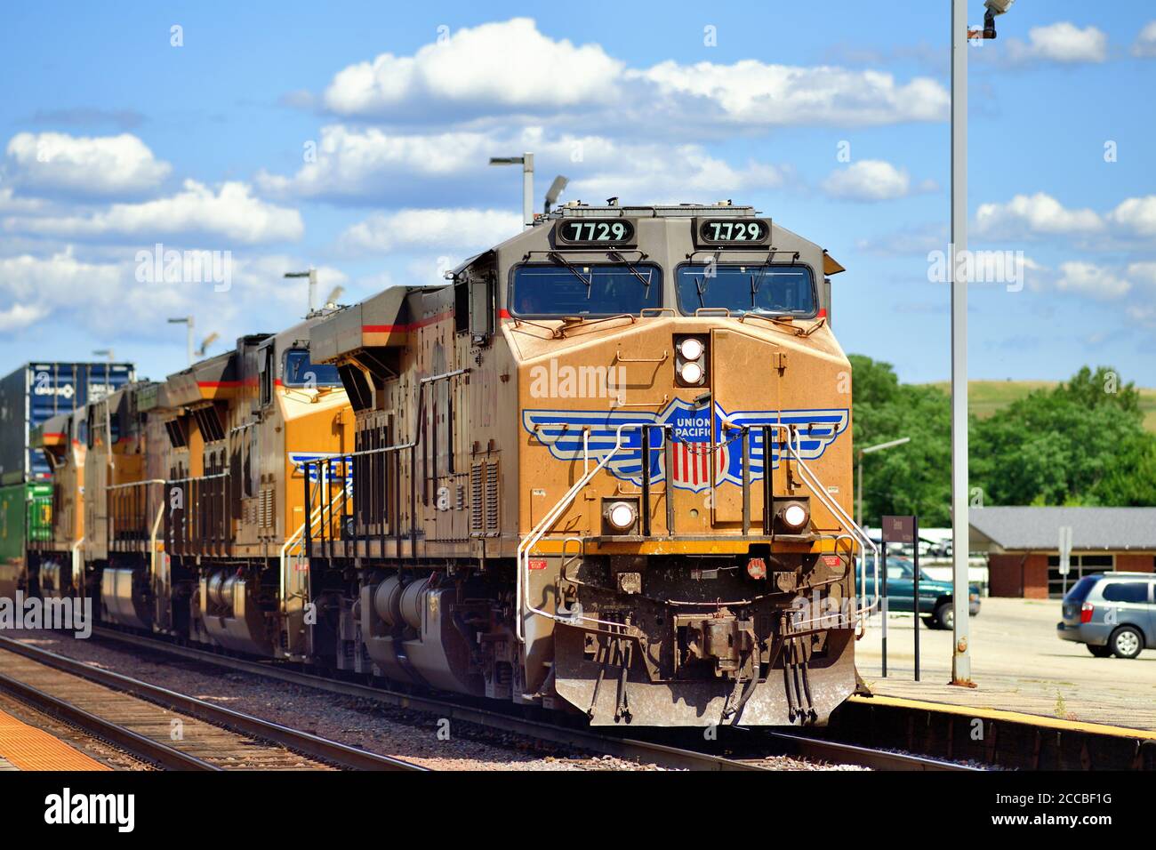 Geneva, Illinois, USA. Four locomotives lead a Union Pacific intermodal freight train through ...