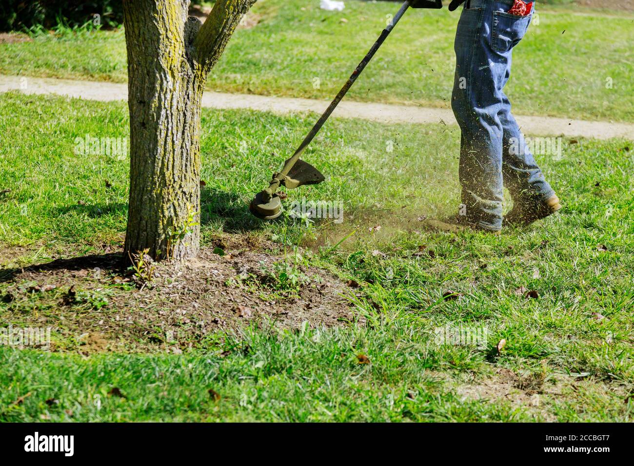 Cutting grass by hand hi-res stock photography and images - Alamy
