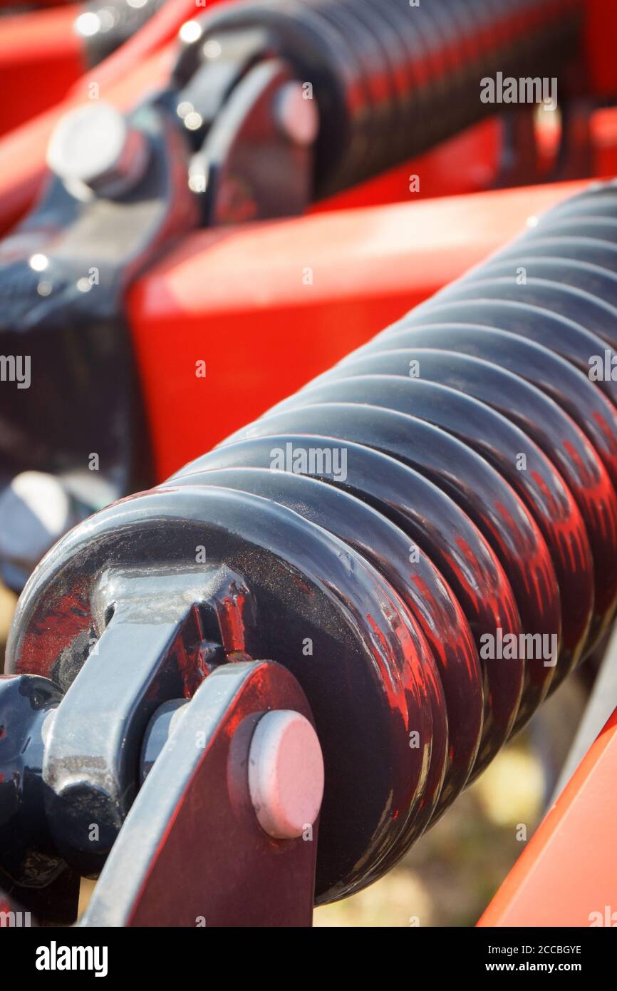 Steel spring in industrial or agricultural machinery. Part and detail ...