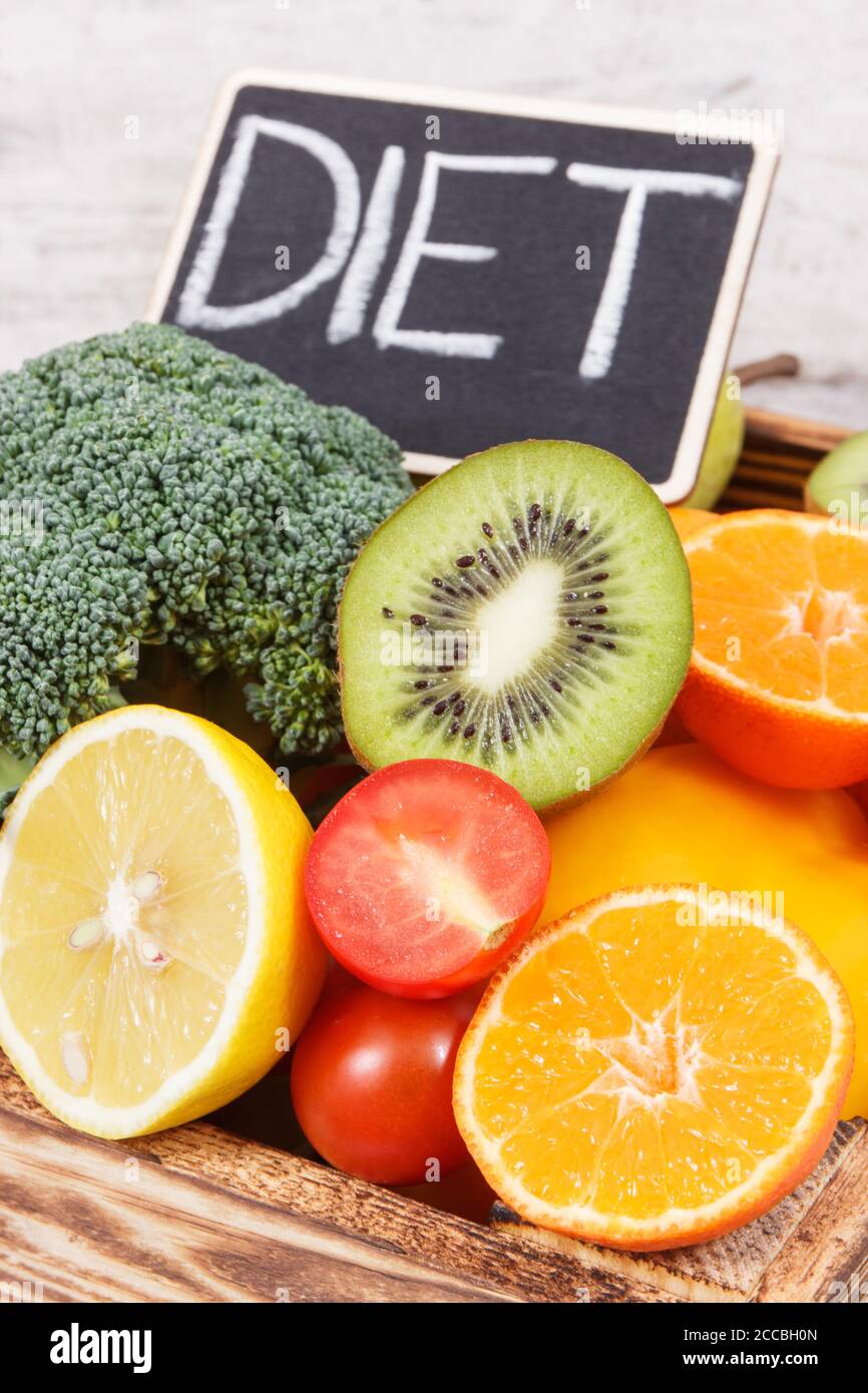 Fresh natural fruits with vegetables in rustic box as food containing ...