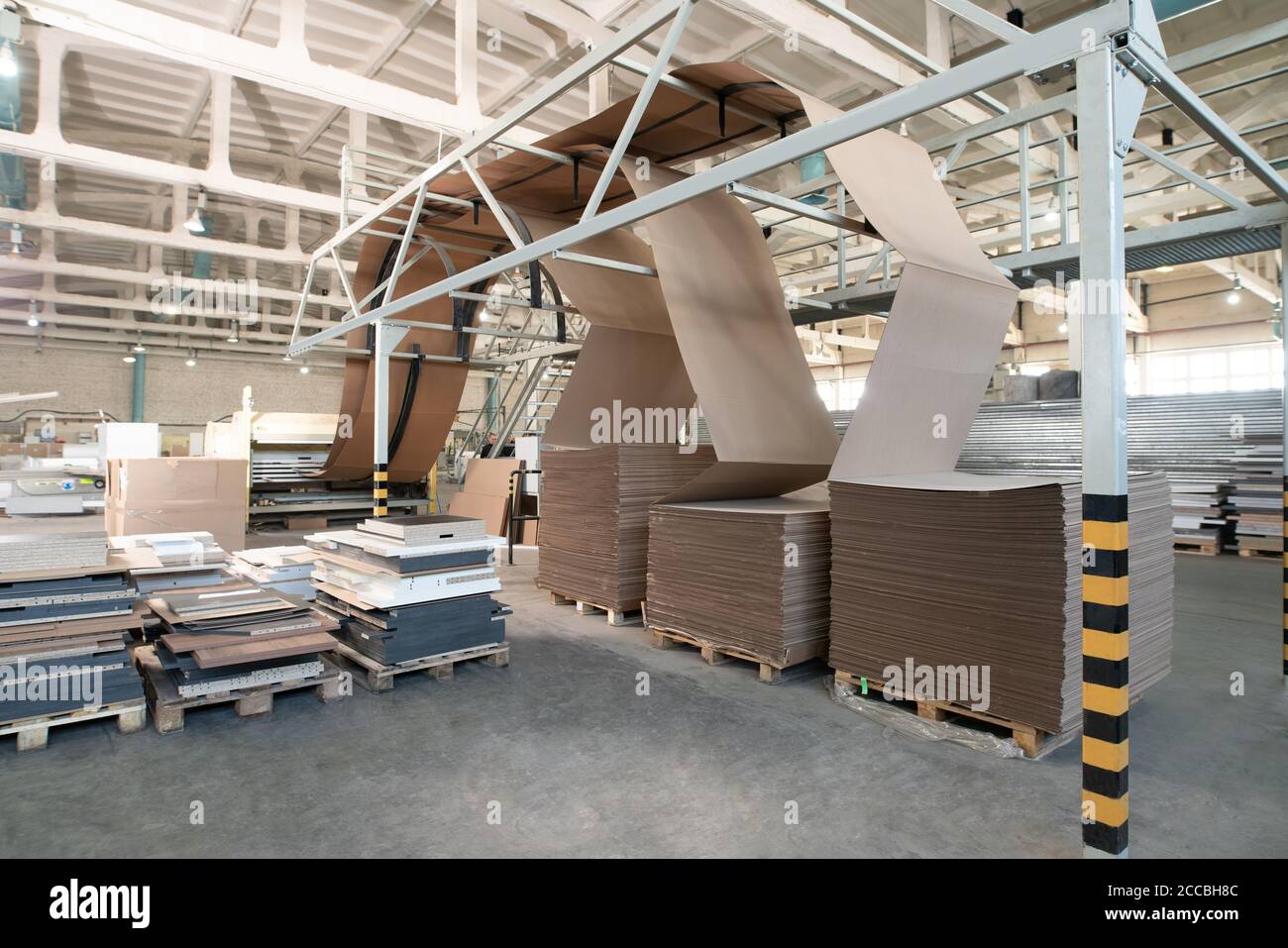 Modern industrial factory producing cardboard Stock Photo - Alamy
