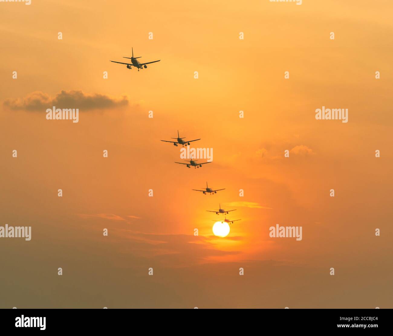 Airplane landing at sunset sky. Sunset is always the magic of ...