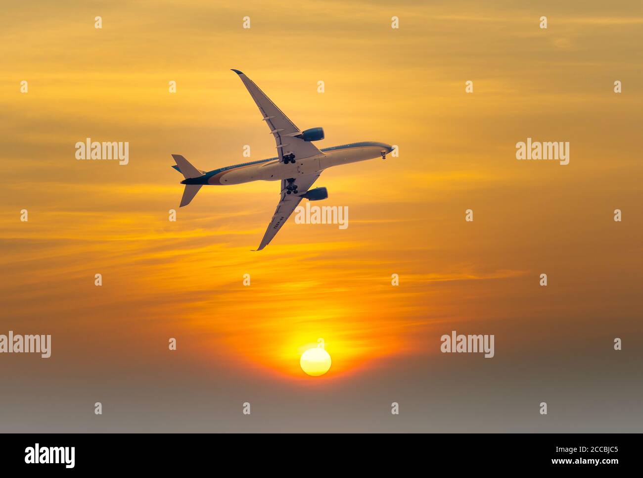 Airplane landing at sunset sky. Sunset is always the magic of ...