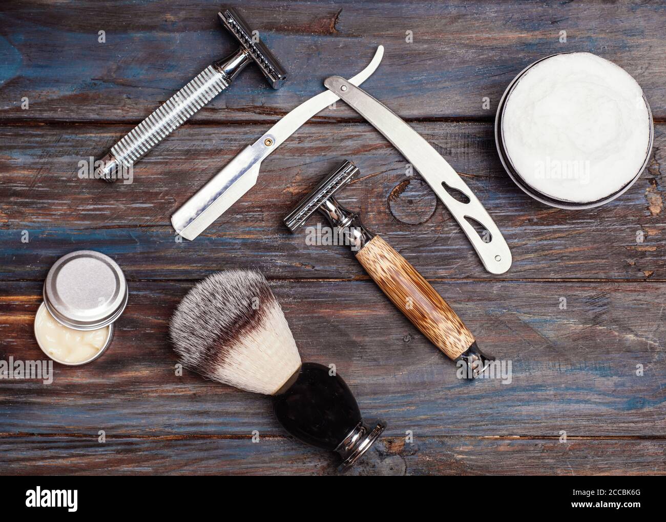 Razors, brush, balsam and foam on a wood background Stock Photo - Alamy