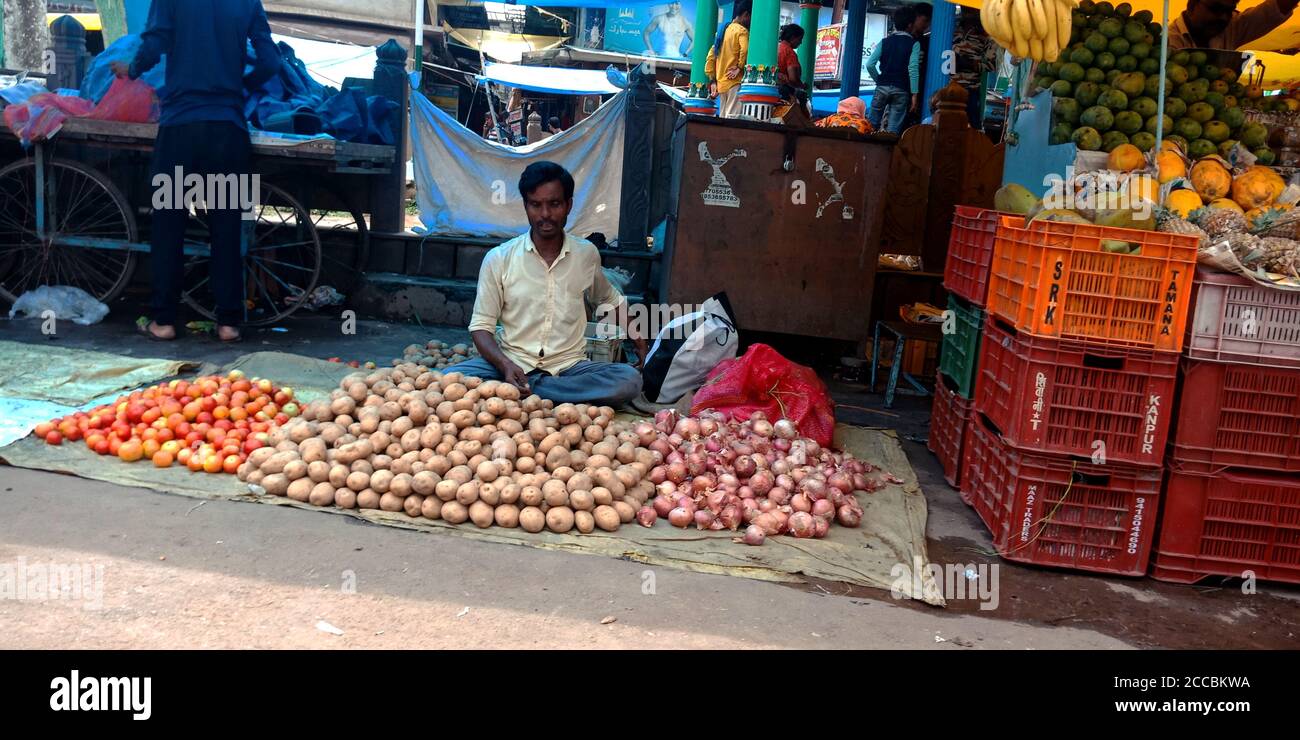 DISTRICT KATNI, INDIA - AUGUST 05, 2019: A poor Indian man at his fruit ...
