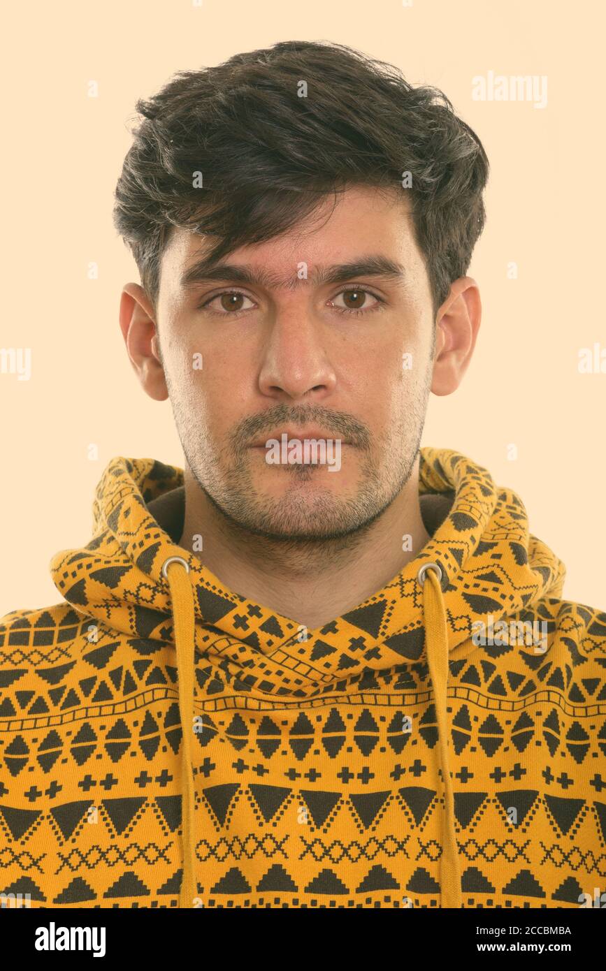 Face of young Persian man wearing hoodie Stock Photo - Alamy