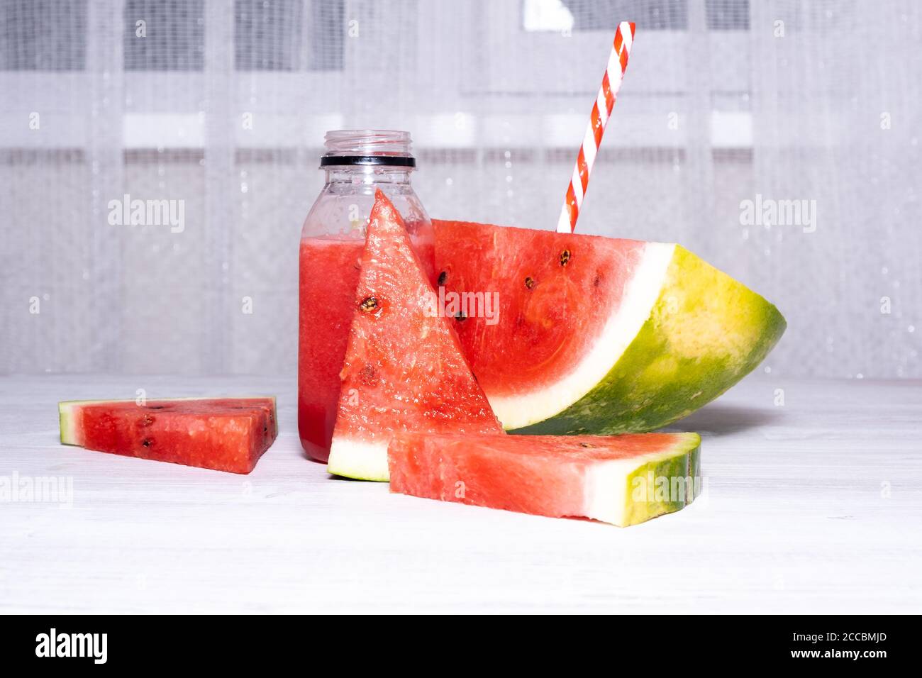 the most beautiful watermelon smoothie and slices of fresh red ...