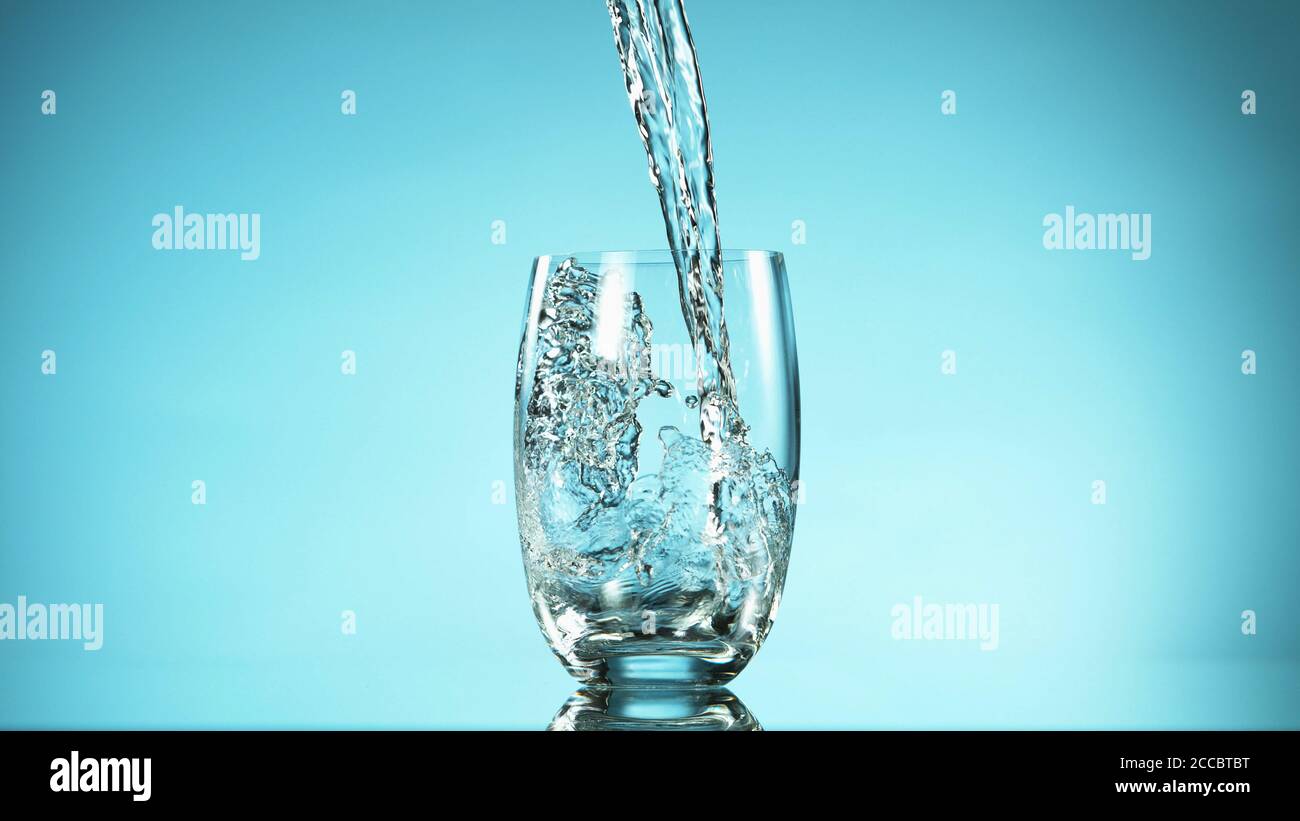 Freeze motion of pouring water into glass, free space for text Stock ...