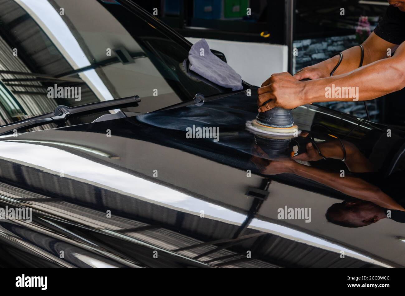 Man hands holding the work tool polish the car.Buffing and polishing ...