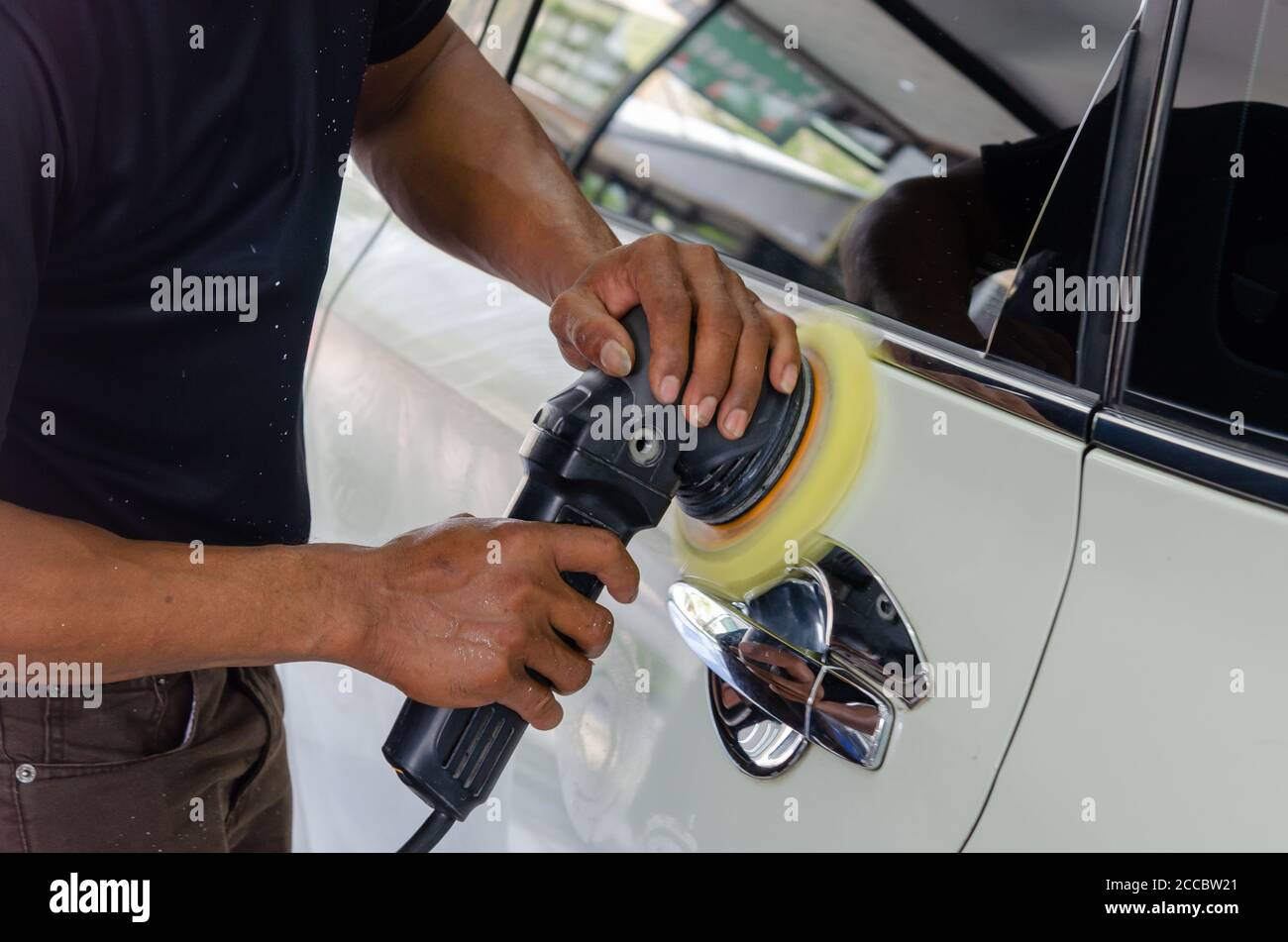 Man hands holding the work tool polish the car.Buffing and polishing ...