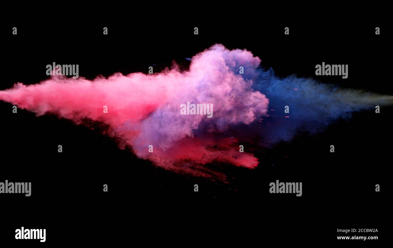 Collision of colored powder isolated on black background. Abstract ...