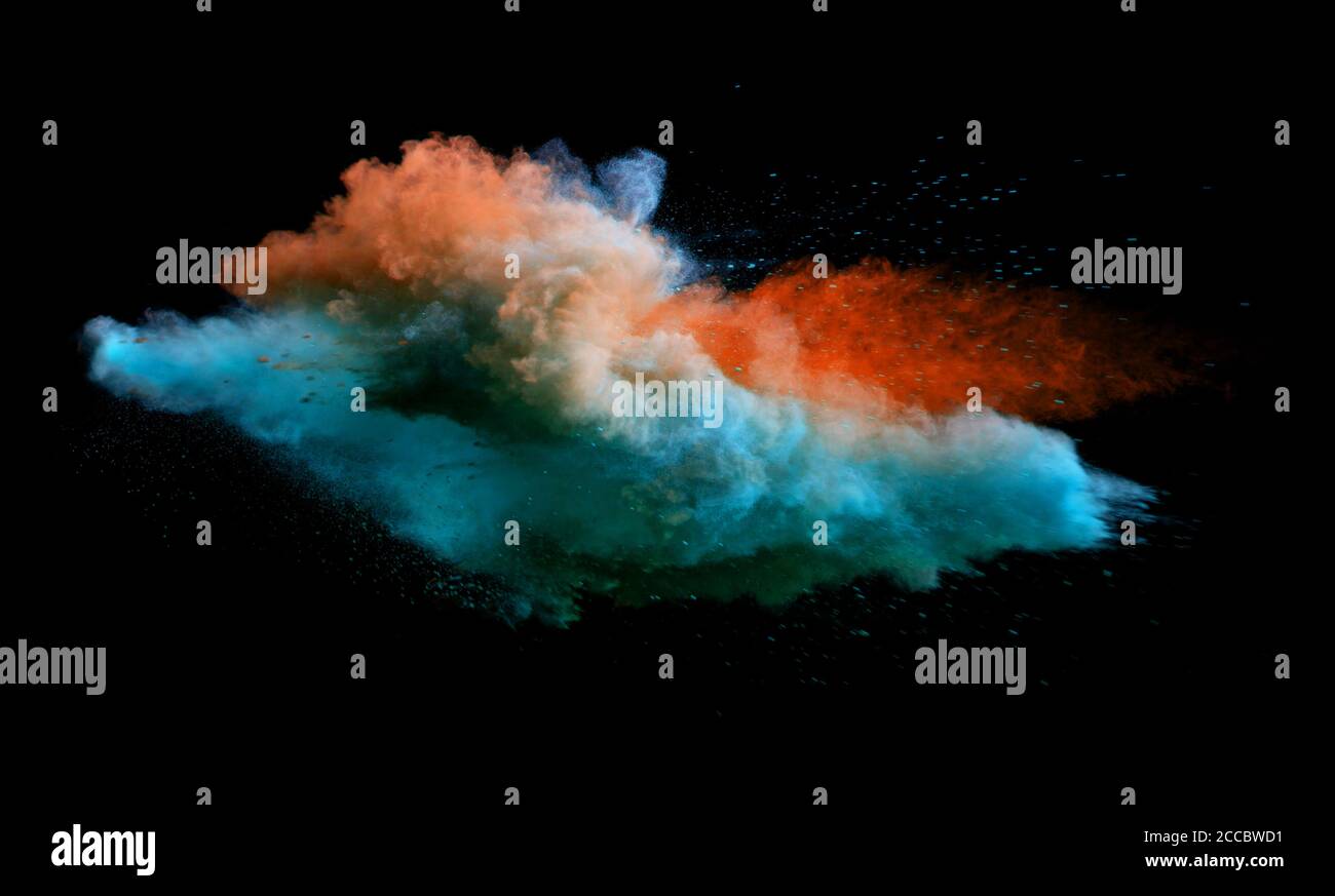Collision of colored powder isolated on black background. Abstract ...