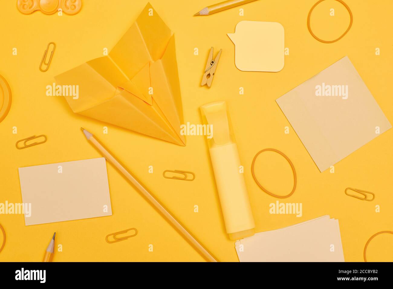 Minimalism, Back to school concept Yellow school supplies on yellow ...