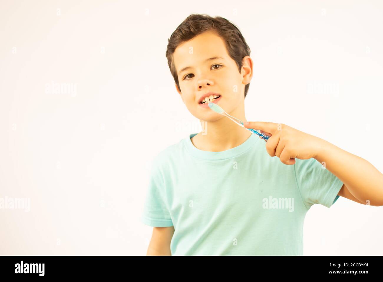 Handsome boy with a toothbrush Stock Photo - Alamy
