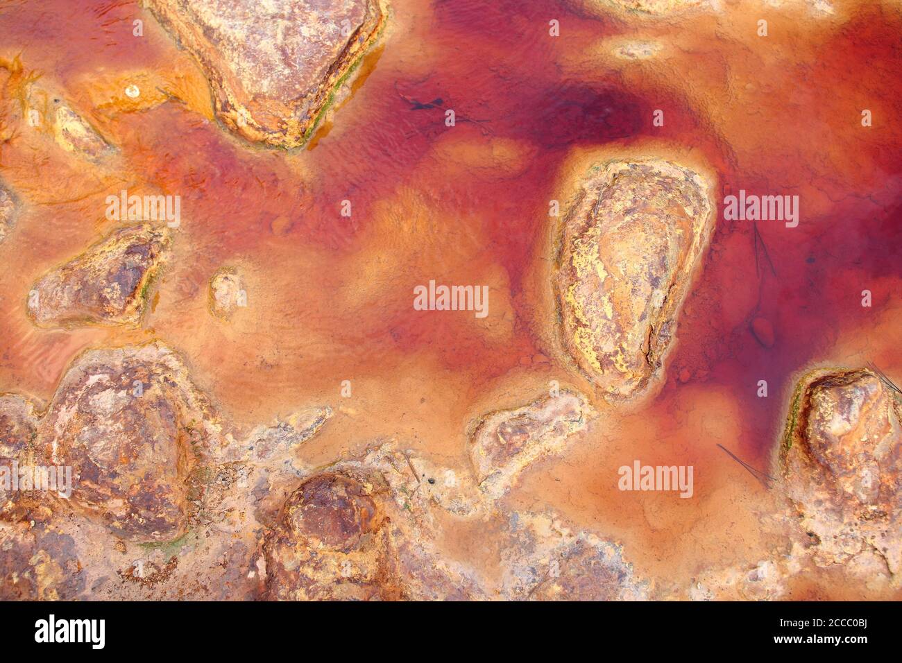 Reddish red river rocks hi-res stock photography and images - Alamy