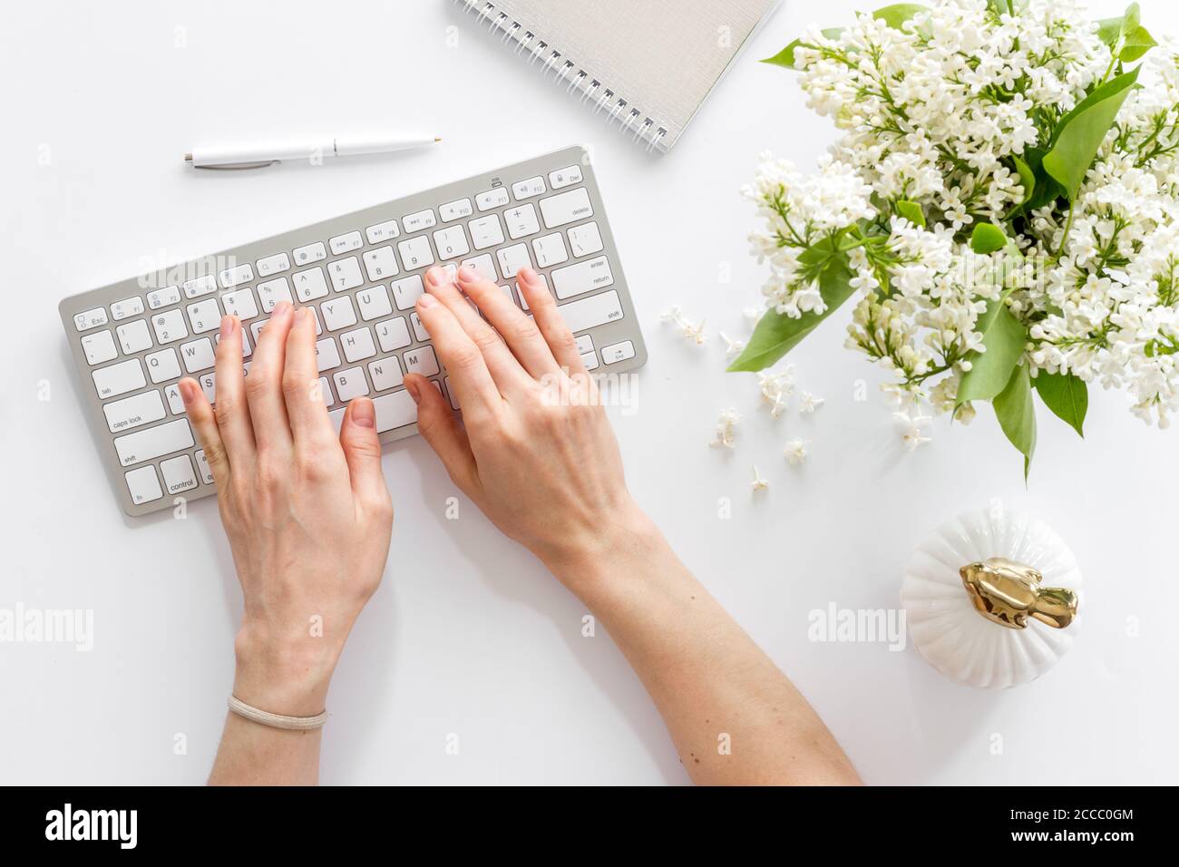Woman s hands writing on office table desk with flowers. Education ...