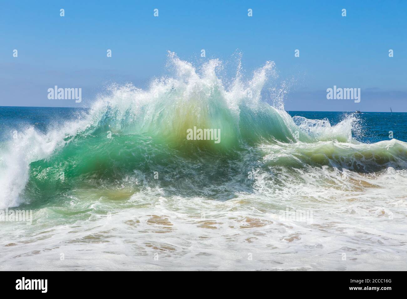 White water spray and sand being pulled up from the bottom by a ...