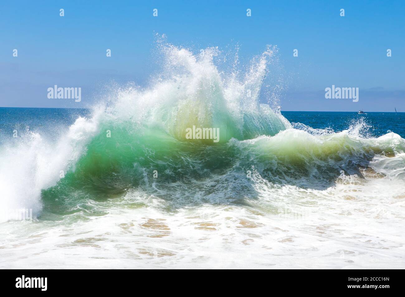 White water spray and sand being pulled up from the bottom by a ...