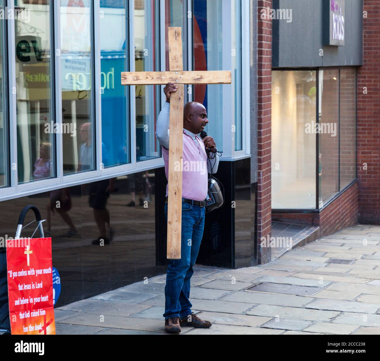 A black male preaching in Durham City centre and carrying a wooden ...