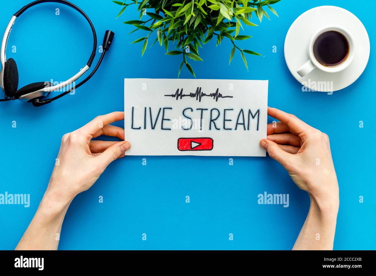 Live streaming web network concept. Female hands holding paper tablet ...
