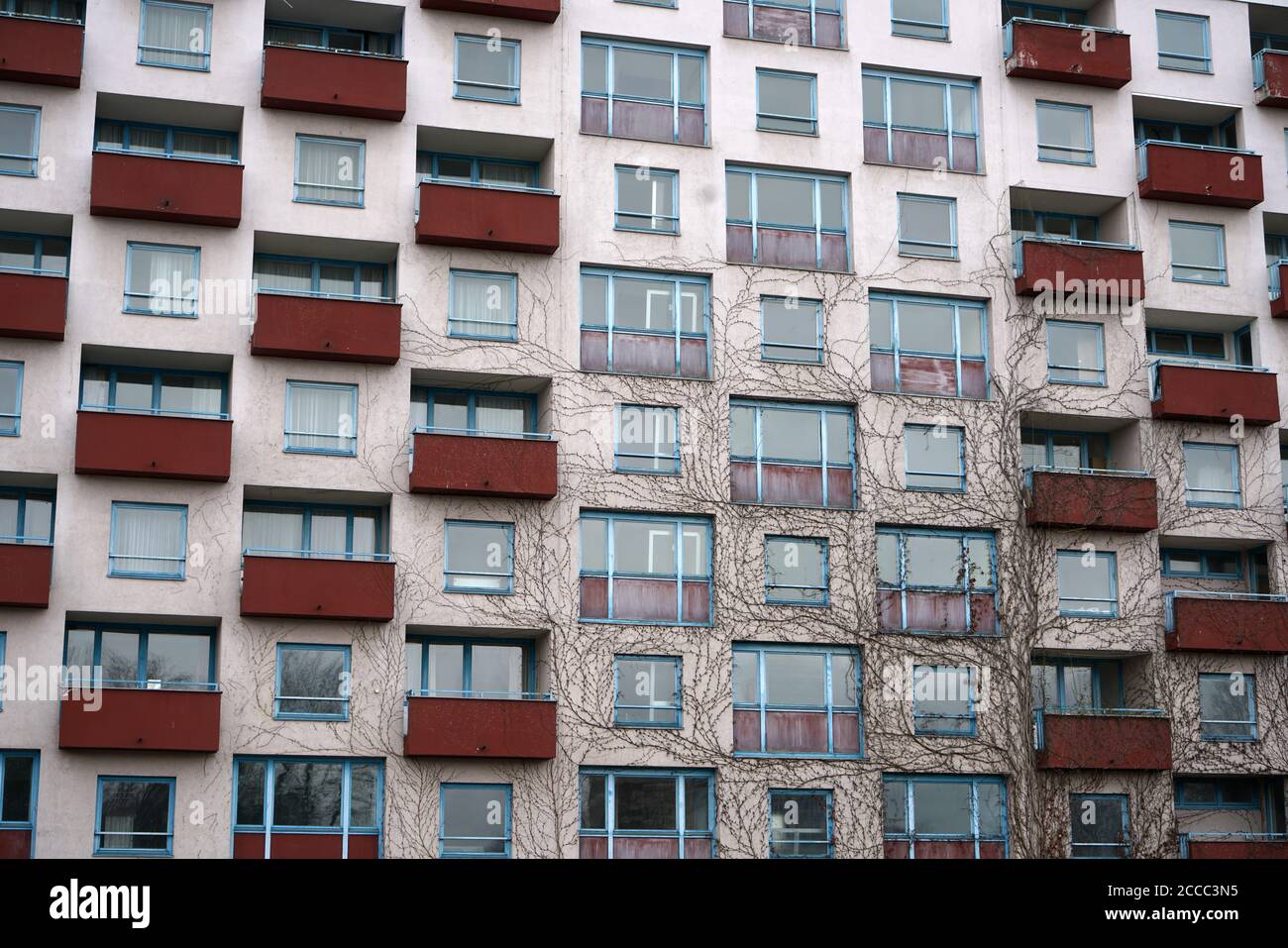 View of windows and balconies of a tenement building Stock Photo - Alamy