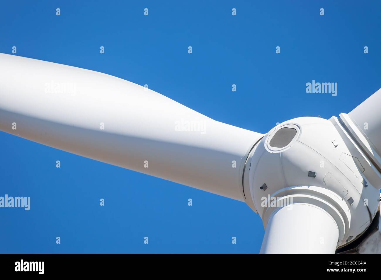 Wind turbine head rotor closeup against blue sky background Stock Photo ...