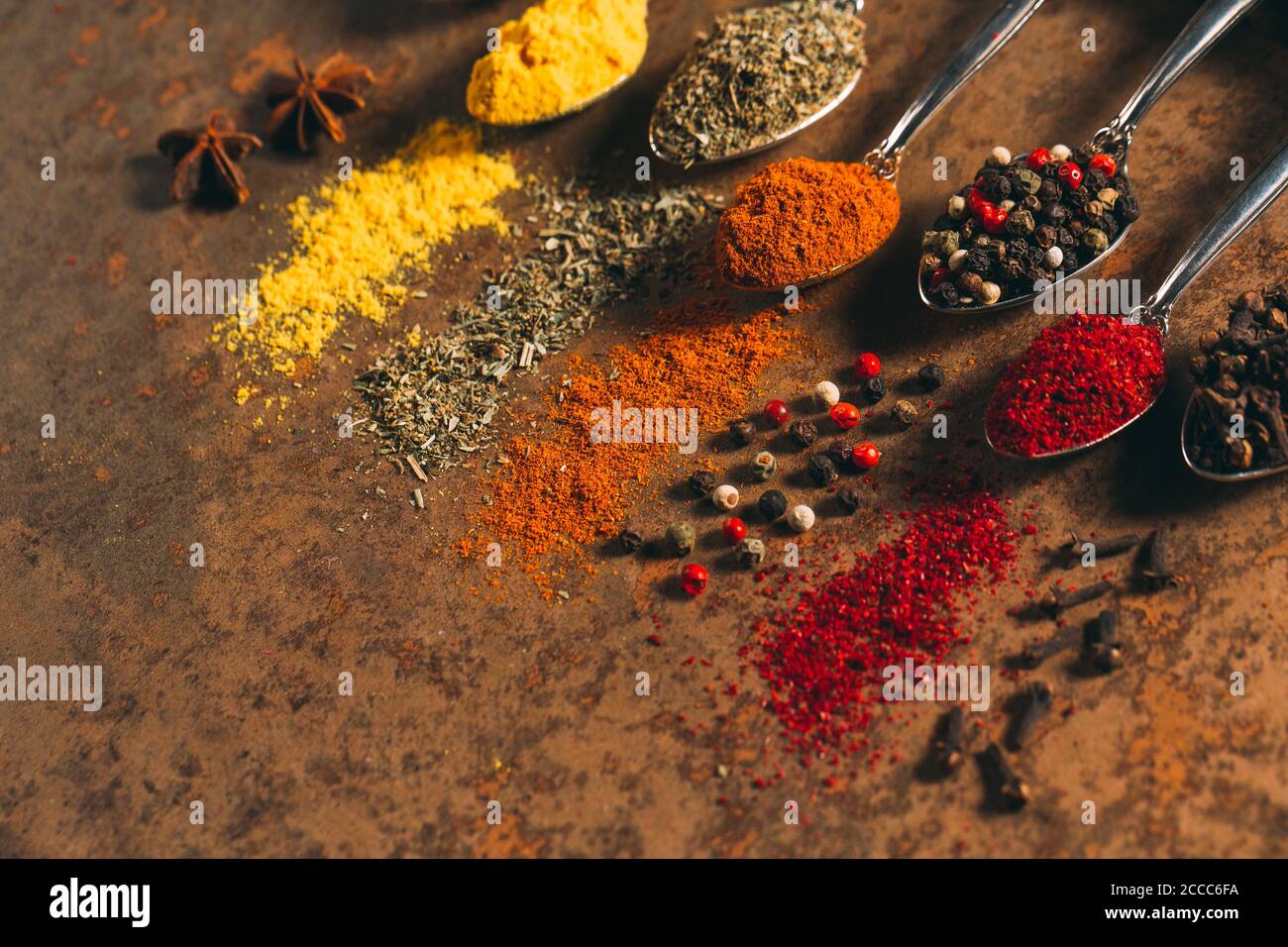 The Different Spices. Spices on stone background Stock Photo - Alamy