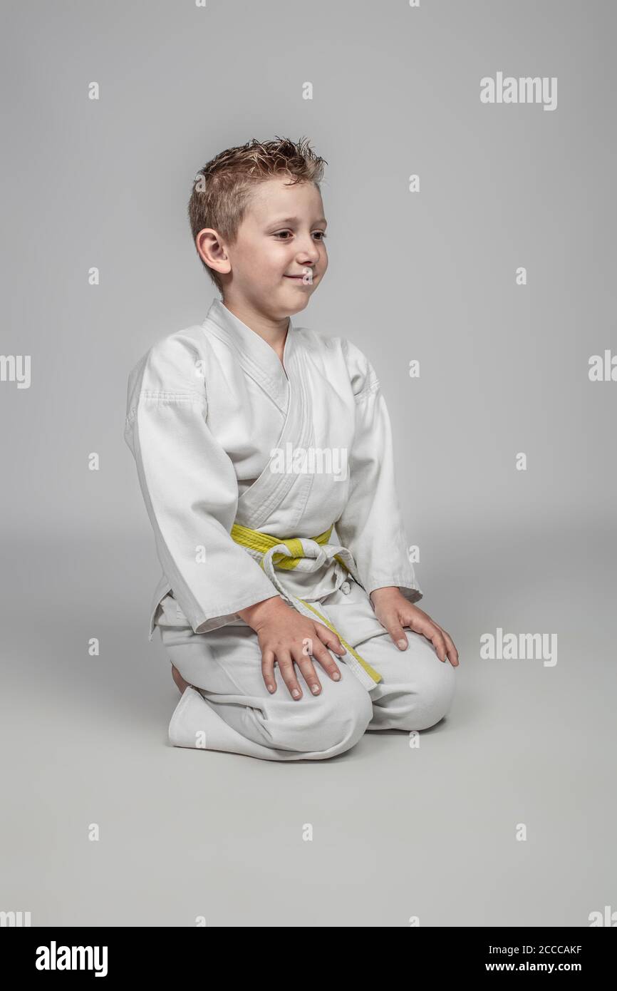 child practicing karate in sitting position in Japanese style. studio ...