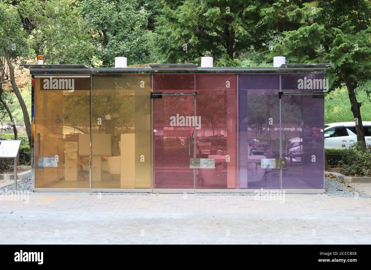 A general view of a transparent public toilet designed by Shigeru Ban ...