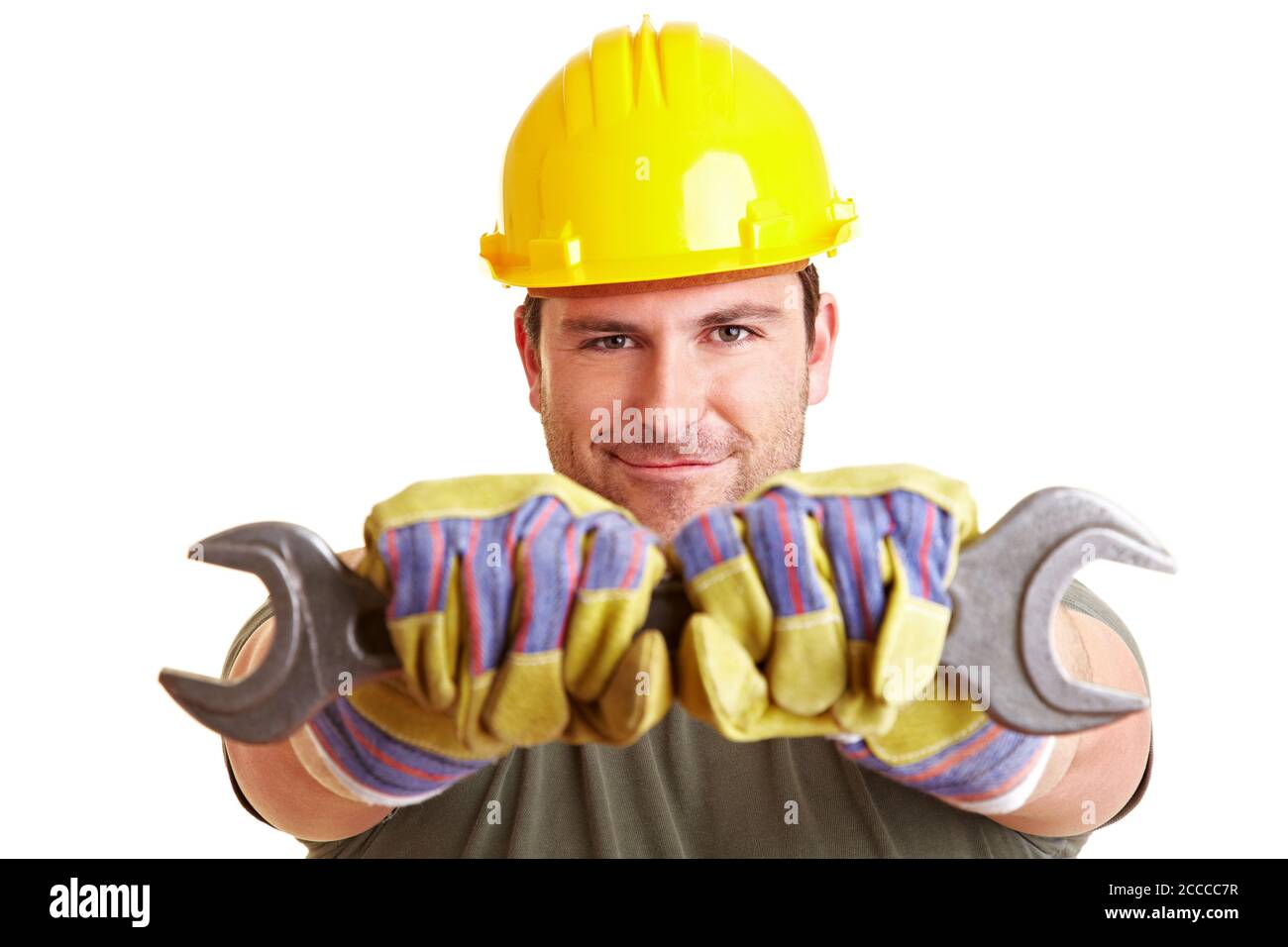 Smiling construction worker shows a large double open-end wrench Stock ...