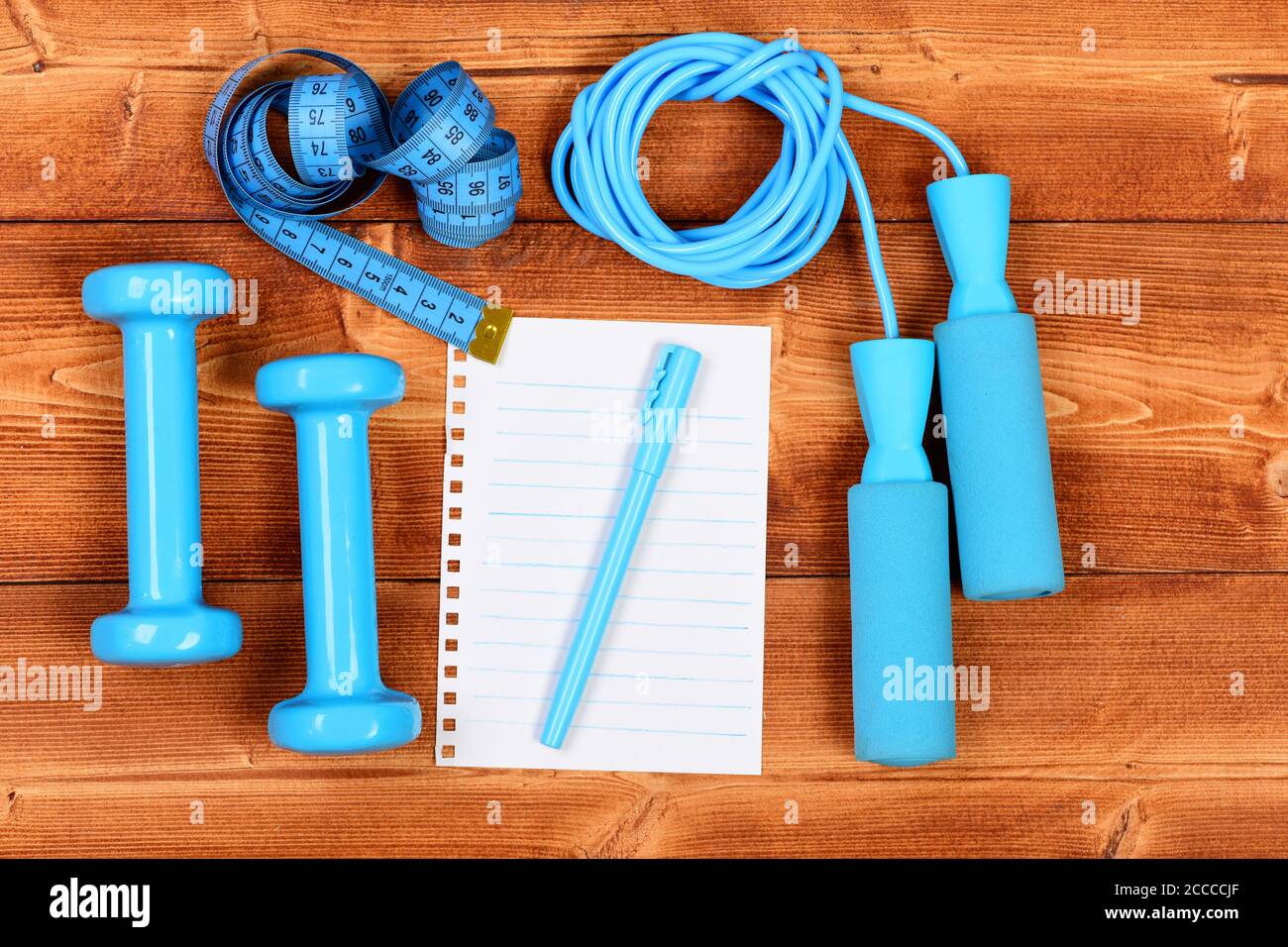 Fitness tools on brown wooden background. Workout and healthy lifestyle ...