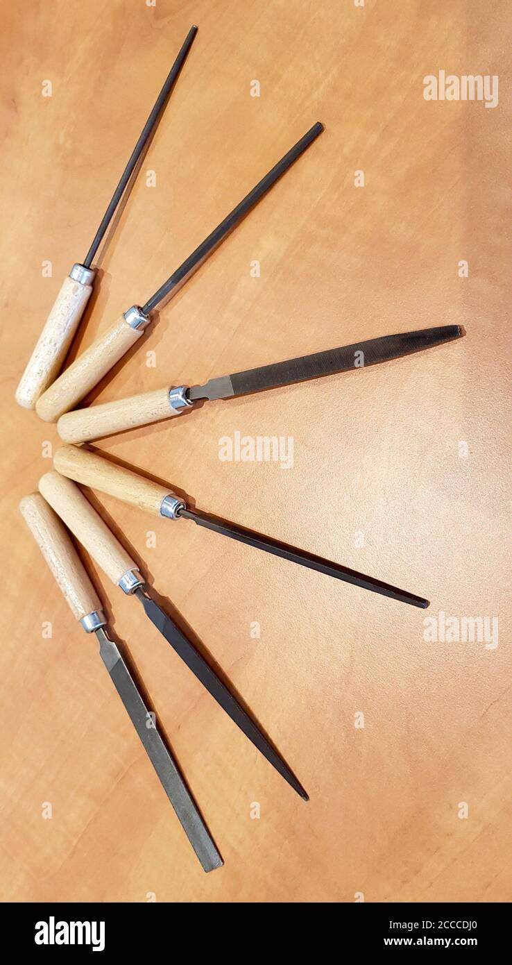 Close up shot of warding file assortment on a wooden table Stock Photo ...