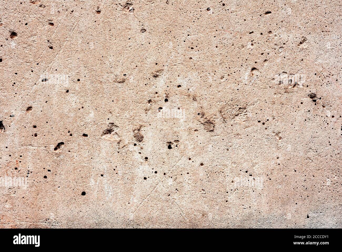 Cream concreted wall for interiors or outdoor exposed surface polished ...