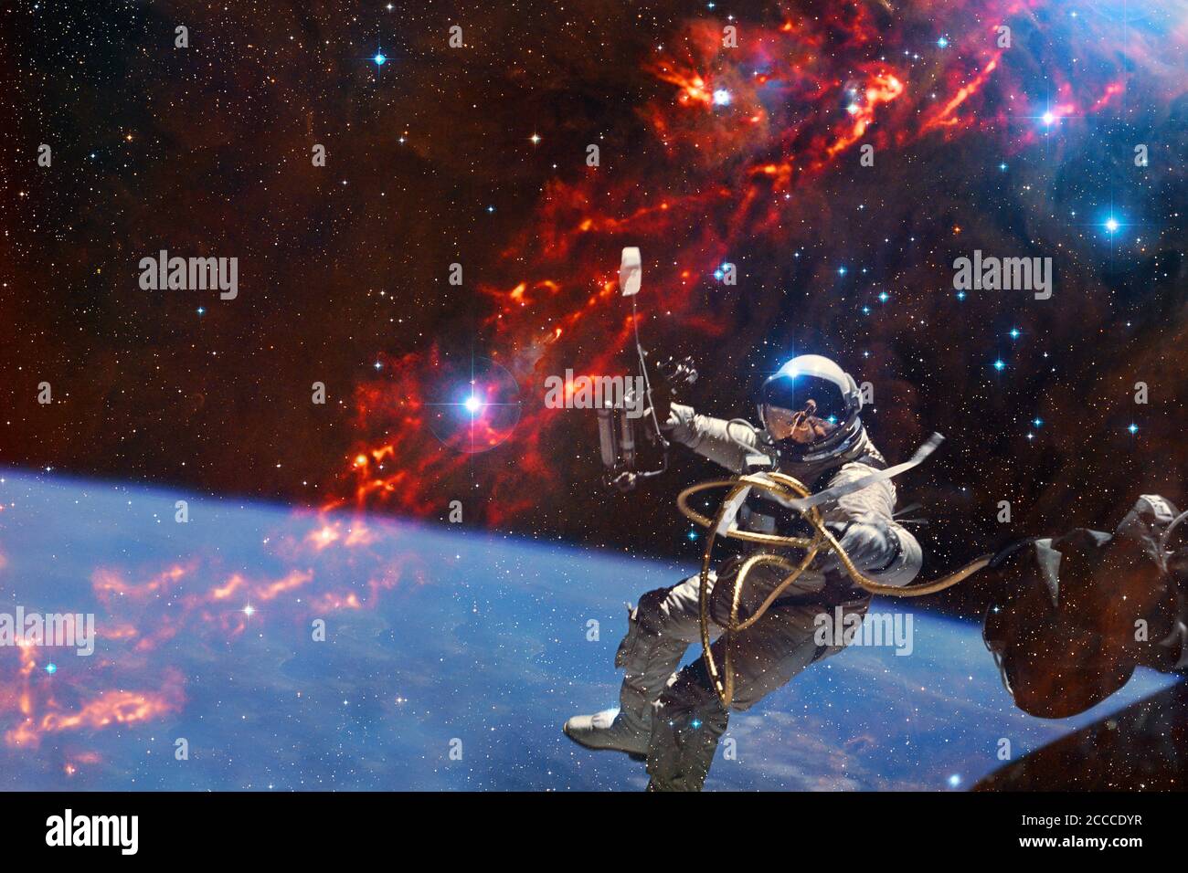 Astronaut. Nebula, cluster of stars in deep space. Science fiction art. Elements of this image ...