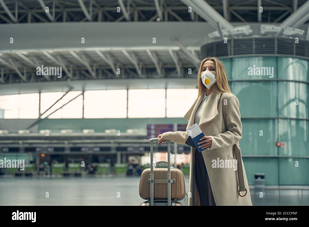 Young long haired woman looking for security checkpoint Stock Photo - Alamy