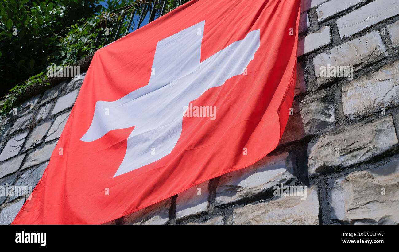 A Swiss flag on a wall Stock Photo - Alamy