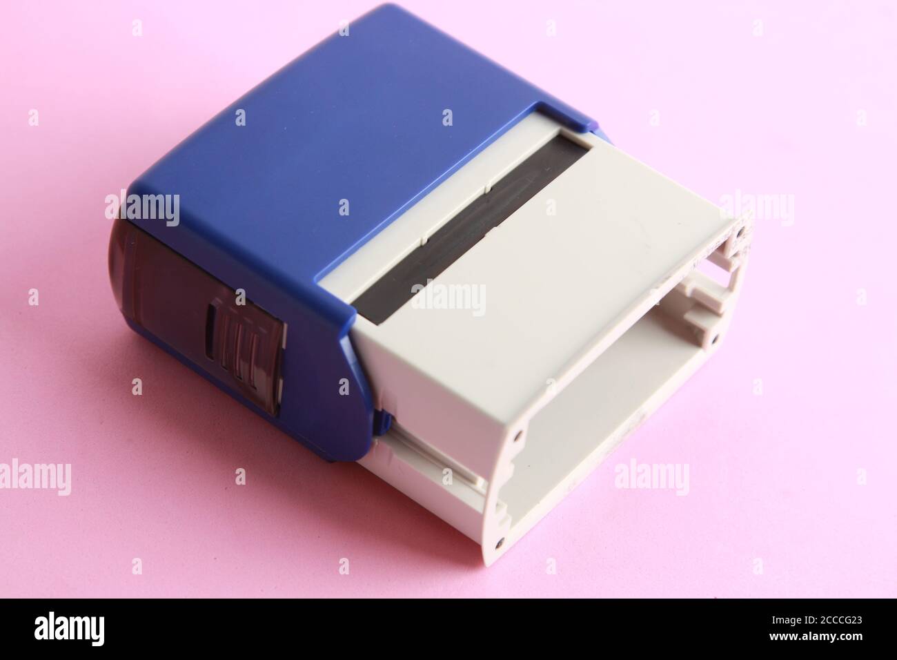 Automatic ink stamp manufactured in blue plastic Stock Photo - Alamy