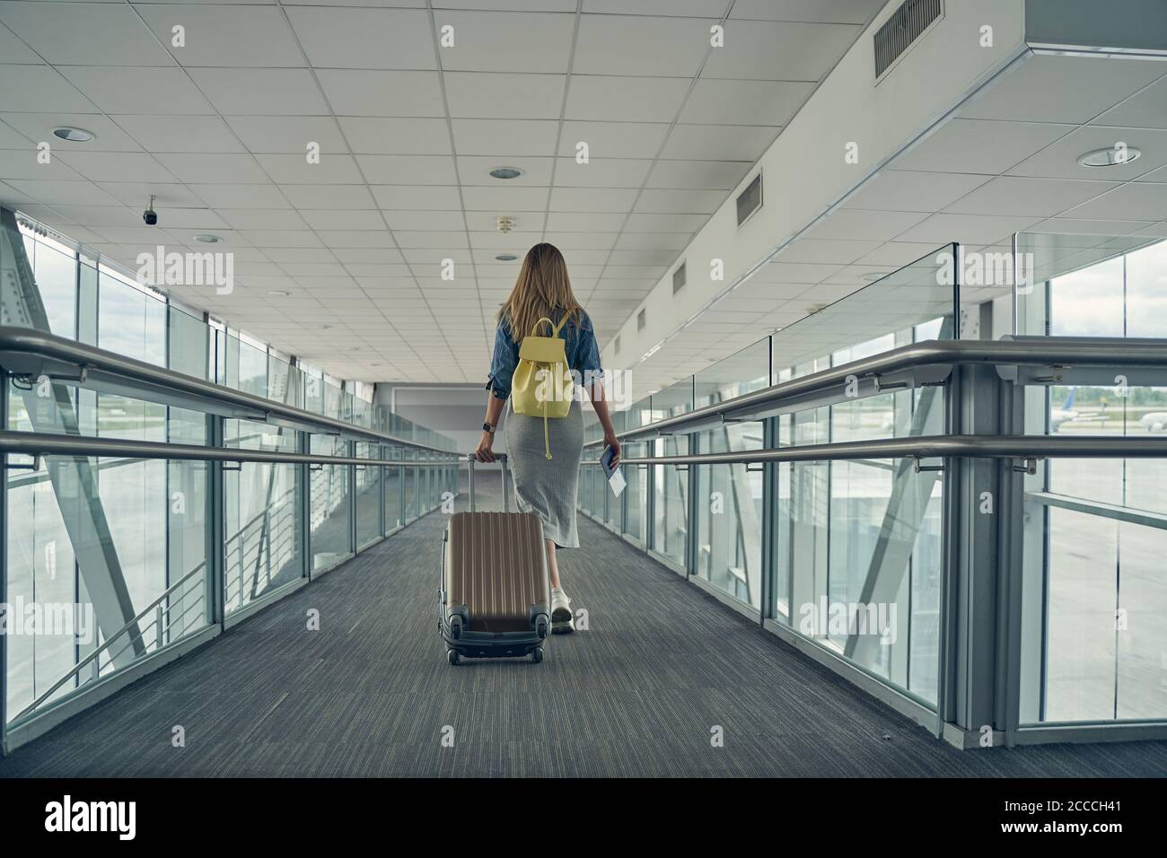 Silhouette of kind female going for boarding Stock Photo - Alamy