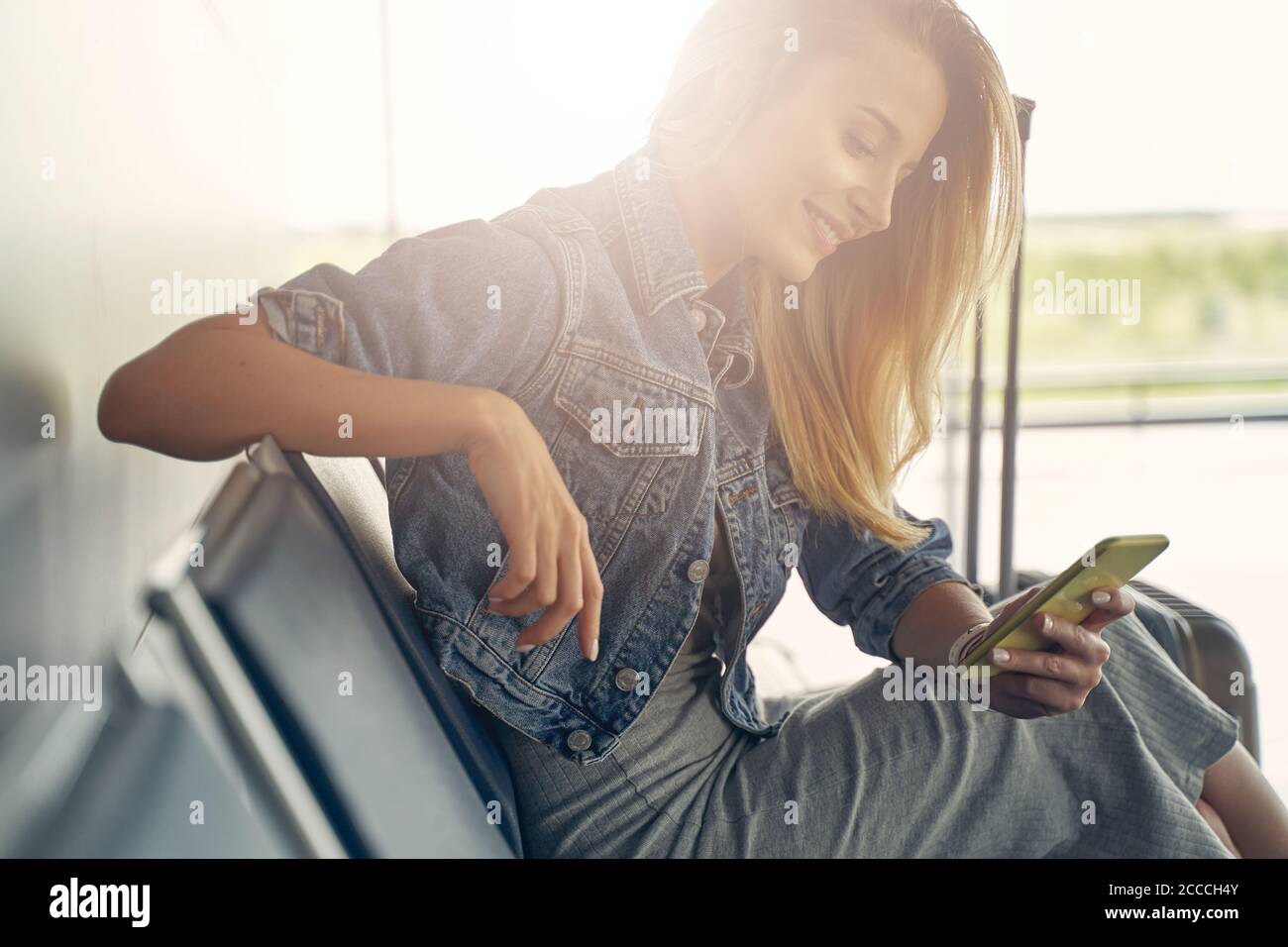 Pleased female person keeping smile on her face Stock Photo - Alamy