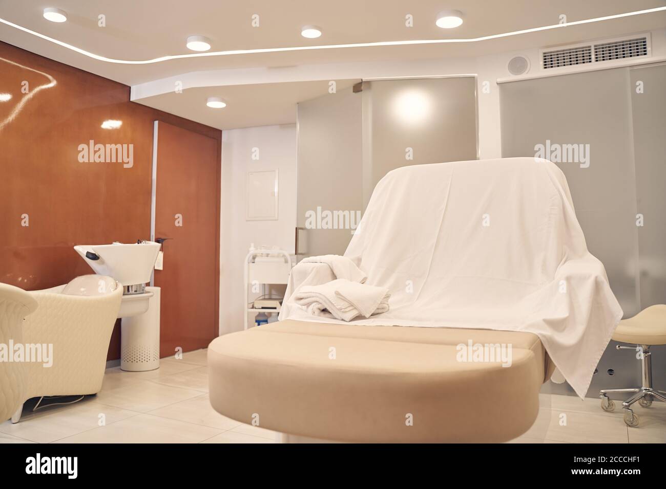Modern spa salon designed in beige color Stock Photo - Alamy