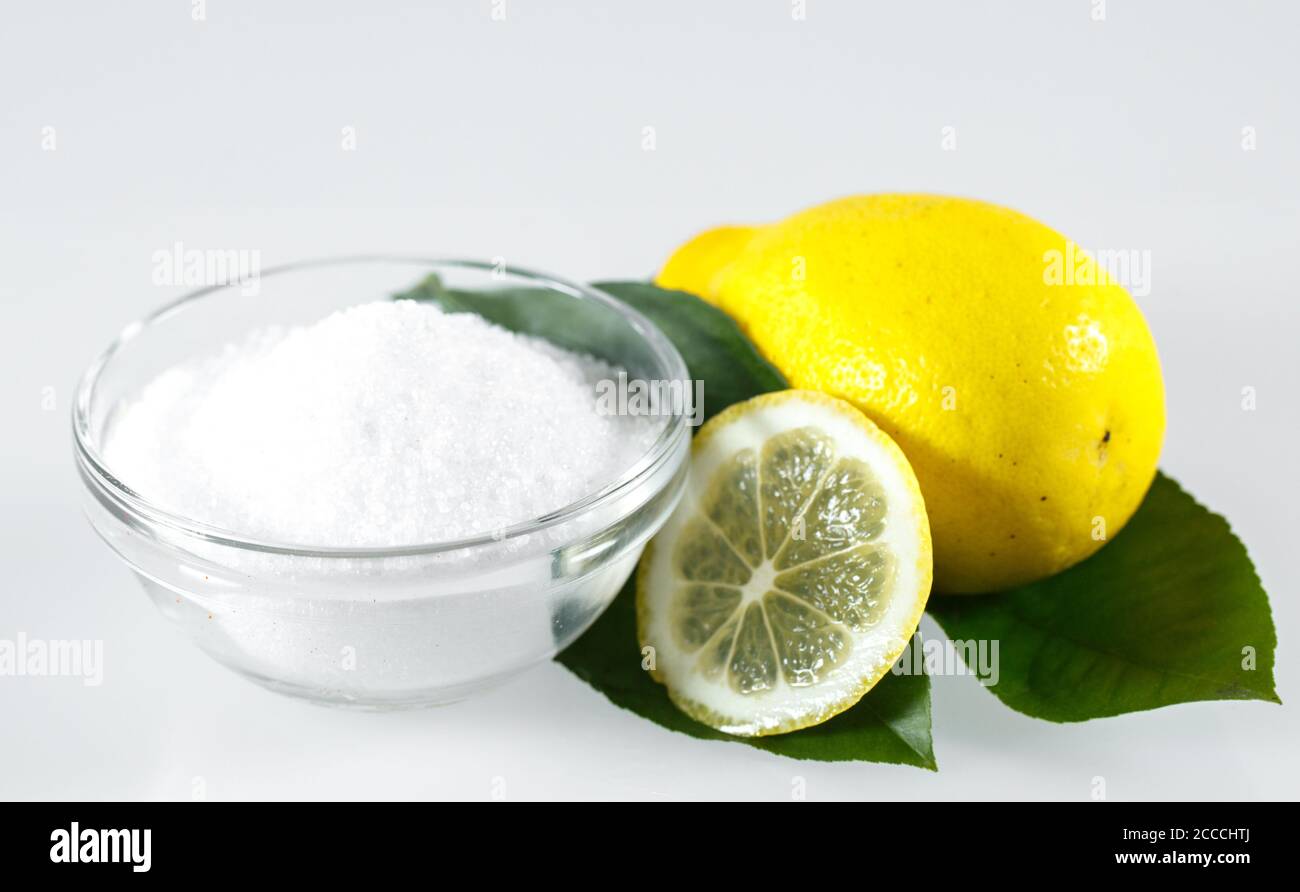 Lemon acid and lemon fruits on the white background Stock Photo - Alamy