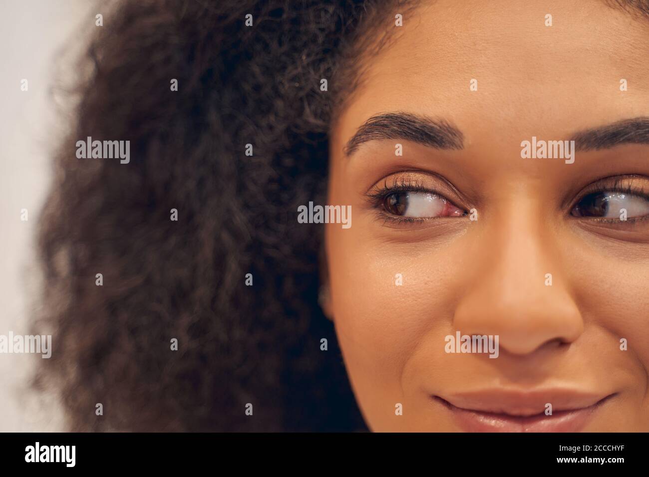 Pleasant attractive female looking away with positivity Stock Photo - Alamy