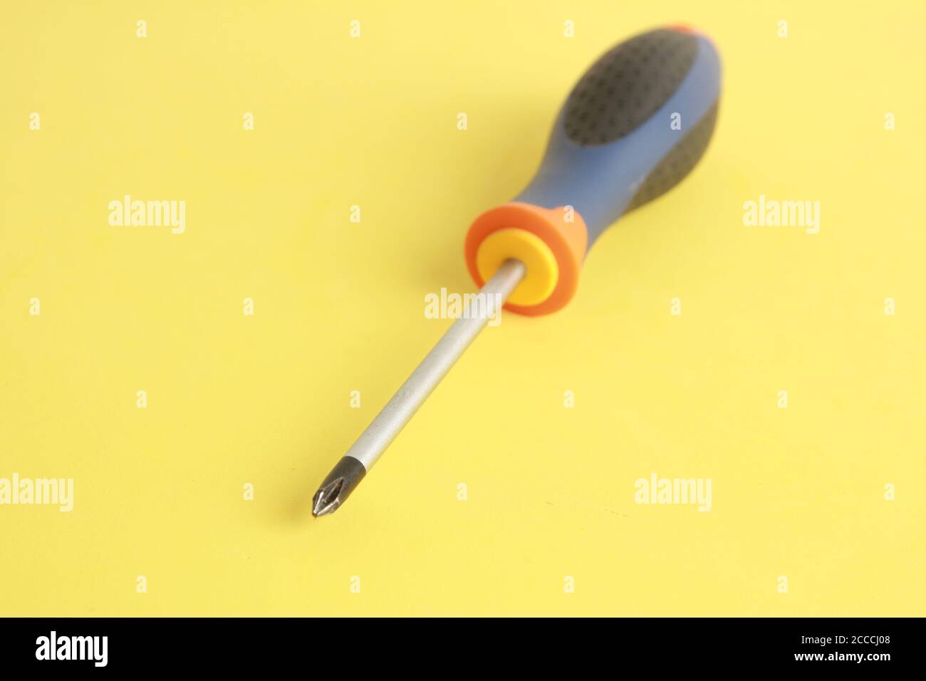 Tipped star screwdriver in orange, blue, and black colors Stock Photo ...