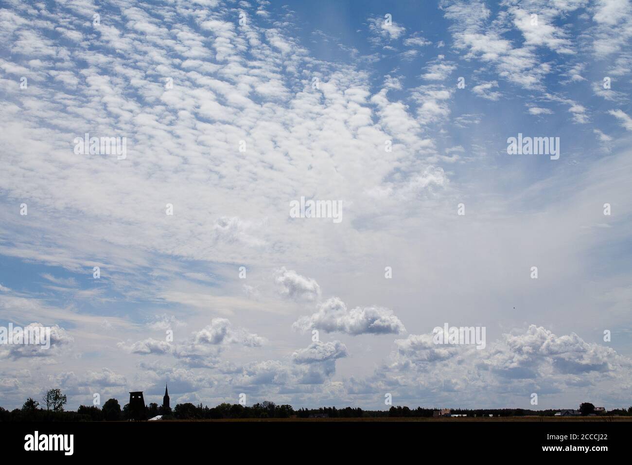 Landscape with blue sky and unique clouds Stock Photo - Alamy