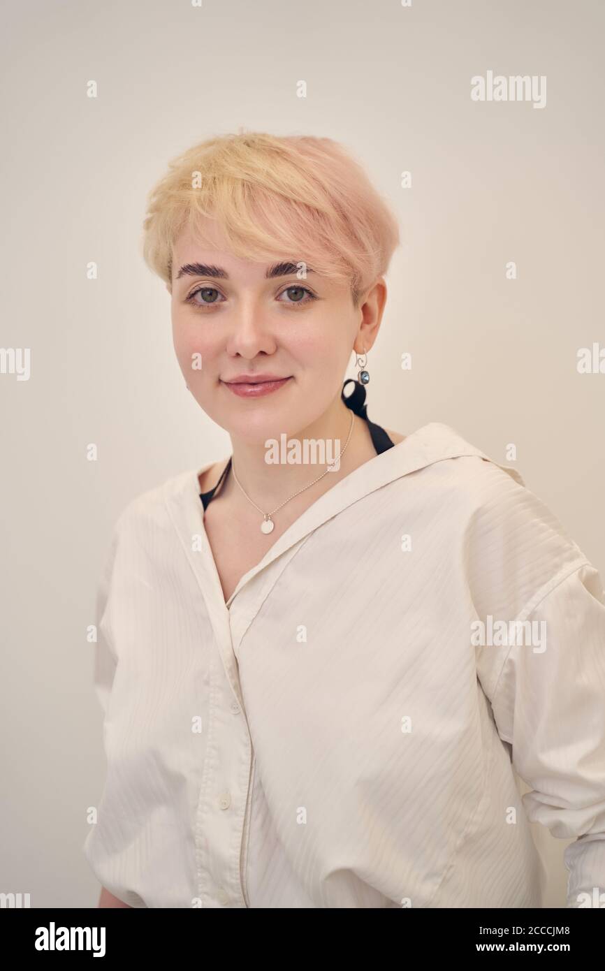 Calm glance of lovely casually dressed lady Stock Photo - Alamy